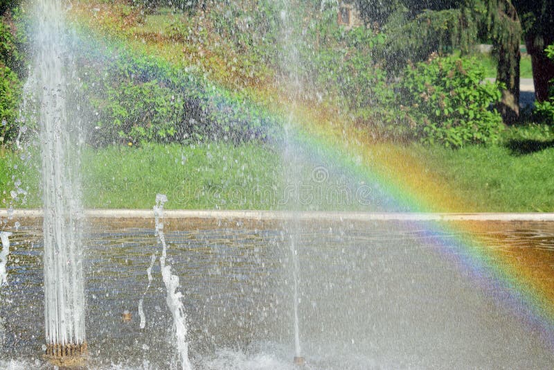 Rainbow Reflected on the Water Fountain on a Sunny Day Stock Image ...