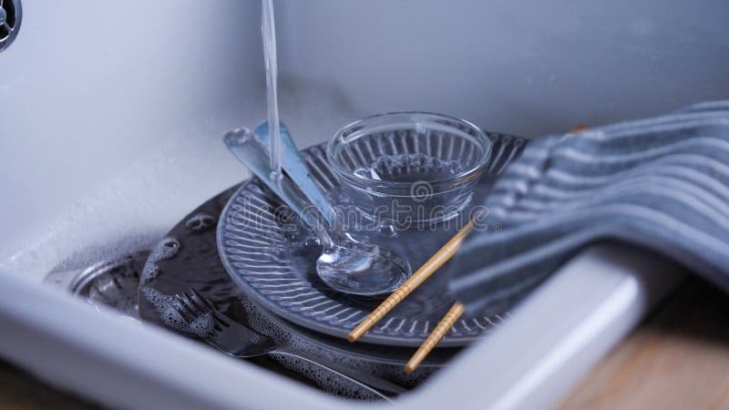 Water Streaming on Dishes in the Kitchen Sink Stock Image - Image of ...