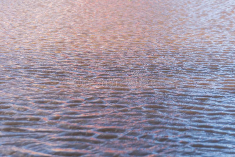 Water on a Sunny Windy Day with Waves and Orange Reflection Stock Image ...