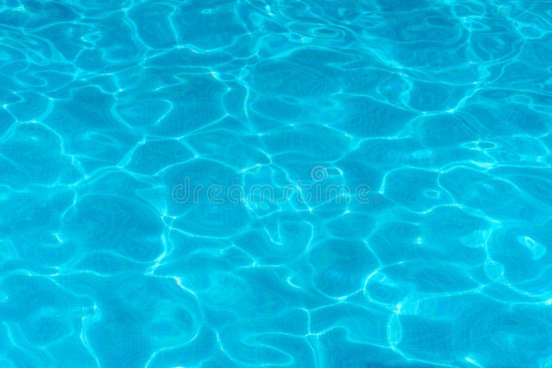 Water Surface with Light Reflections in a Swimming Pool As a Background ...