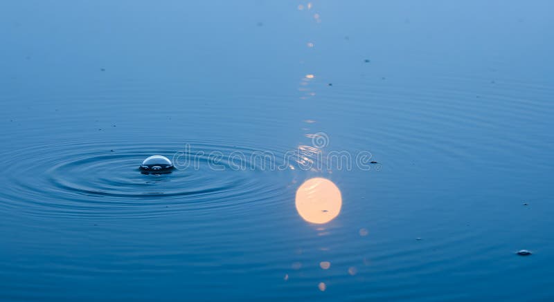 Water Surface with Ripple Effect and Light Reflection Creating Serenity ...