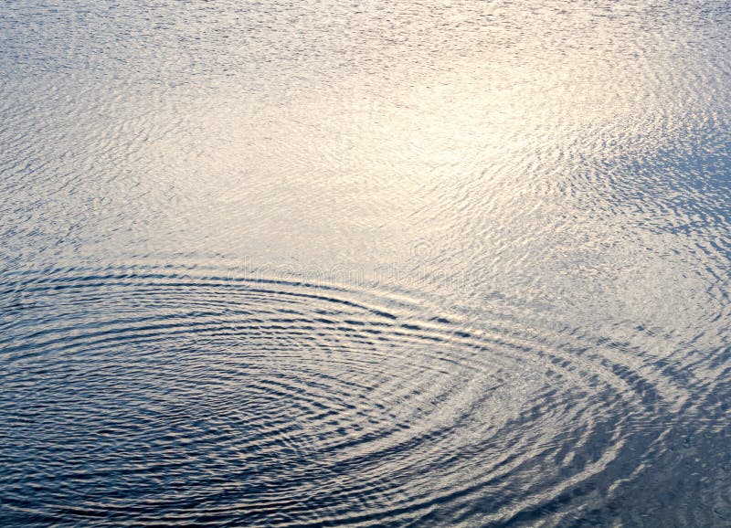 Split Debris Of Purple Stone Exploding With Blue Dry River Sand Against ...