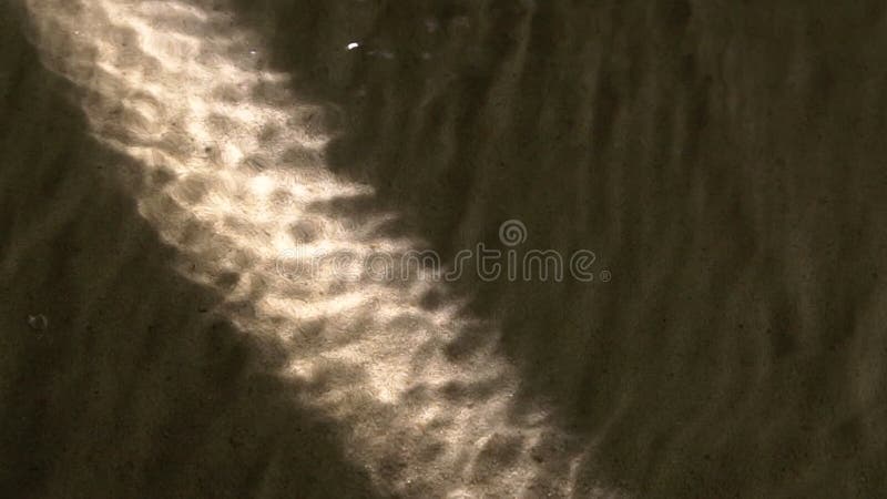 Water Surface Ripples and Splashes, Bright Light and Shadow on Dark ...