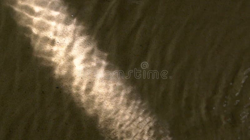 Water Surface Ripples and Splashes, Bright Light and Shadow on Dark ...