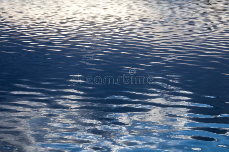 Water Surface with Sky and Sun Reflections Stock Image - Image of ...