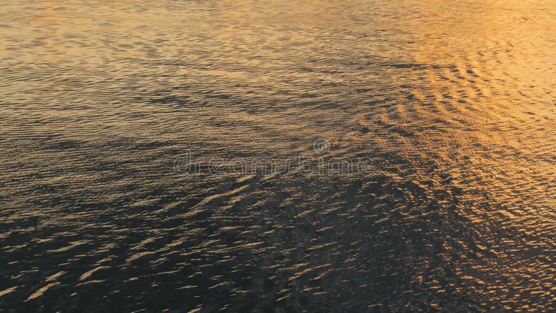 Water surface at sunset stock image. Image of sunset - 123984163