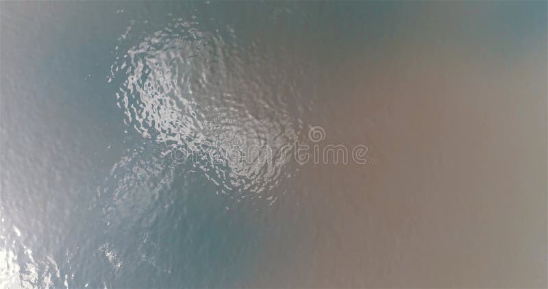 Water Surface from Above, Ripples on the Water. Glare on the Water ...