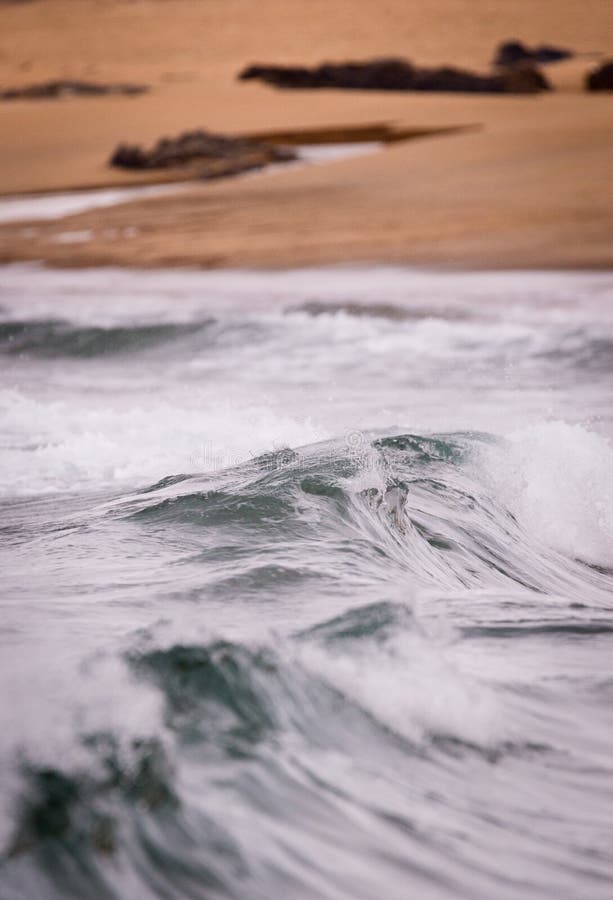Water Surface. Wave Photography with Sand on Background Stock Image ...