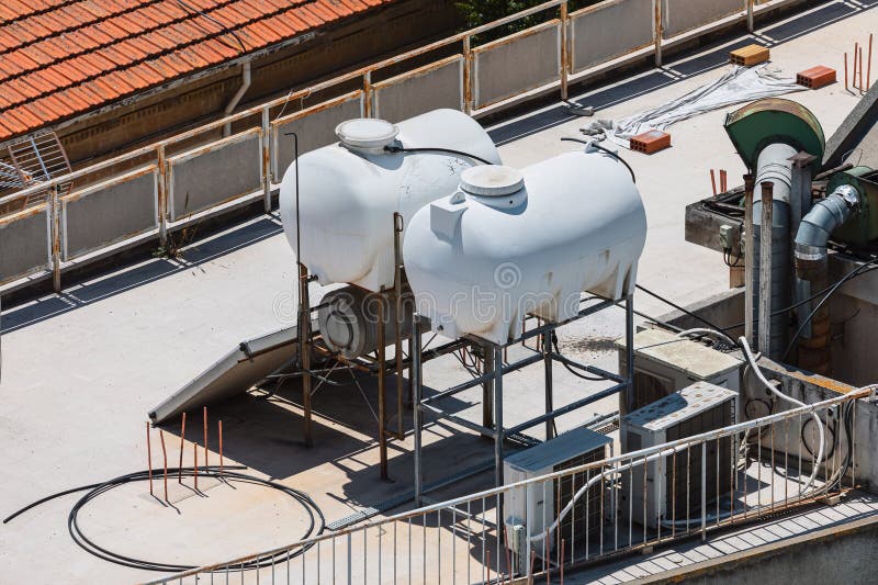 Water tank on a rooftop stock image. Image of height - 322543685
