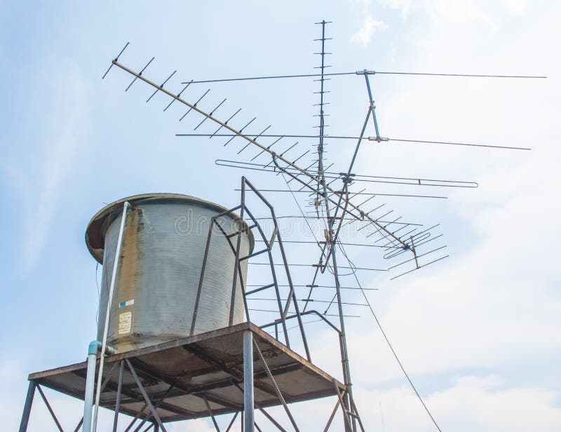 Water tank and tv antenna stock photo. Image of white - 41053068