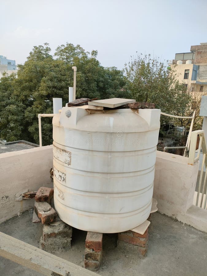 Water Tank of White Colour on House Roof Stock Photo - Image of tank ...