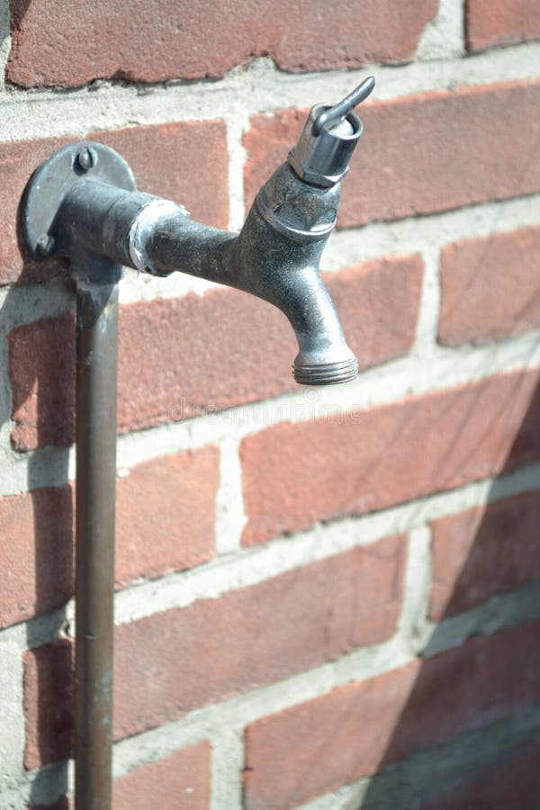 Water Tap Attached To a Brick Wall Stock Image - Image of brick ...