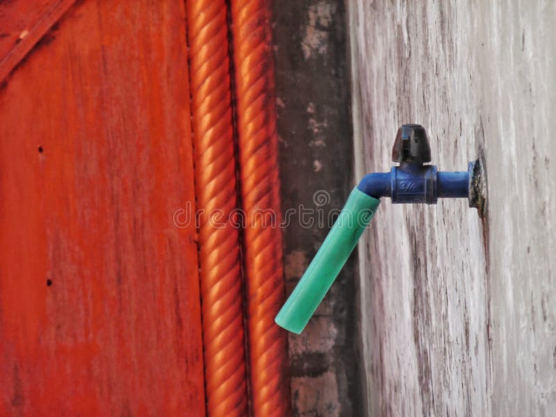 Water tap with blue hose stock image. Image of blue - 332122193