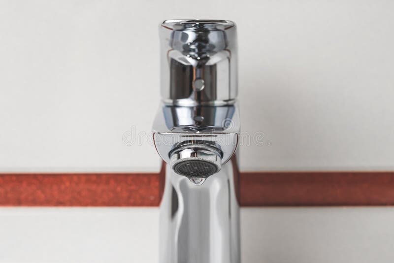 Water Tap Close-up. a Drop of Water is Dripping from the Tap. Stock ...