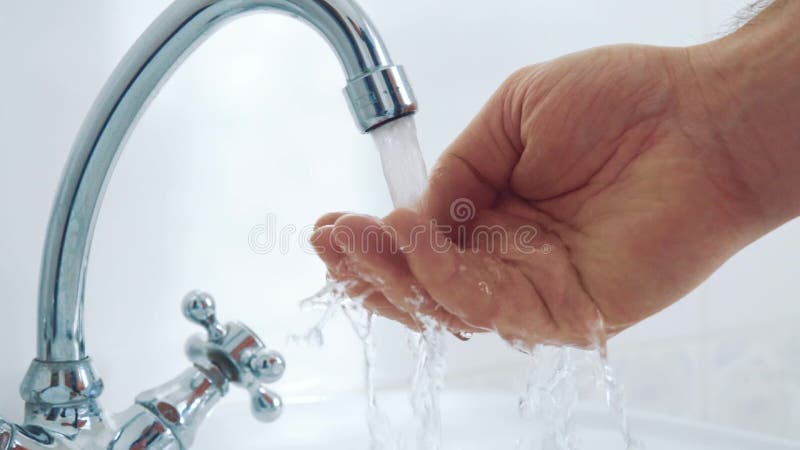 Water from the Tap Flows To the Hand. Slow Motion Stock Footage - Video ...