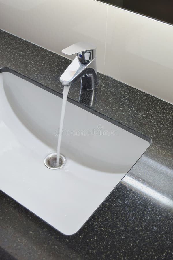 Water Tap and Under Counter Wash Basin with Granite Top Stock Image ...