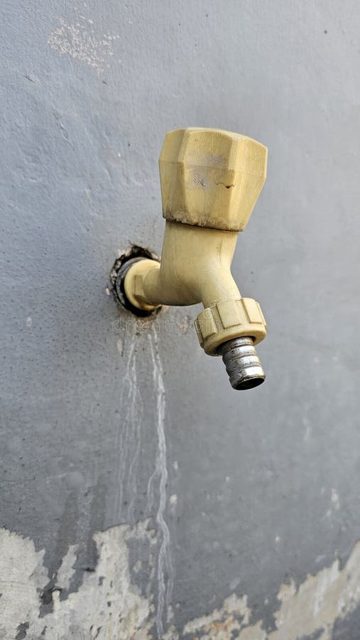 Water Taps Made of Plastic and Aluminum are Attached To Gray Walls ...