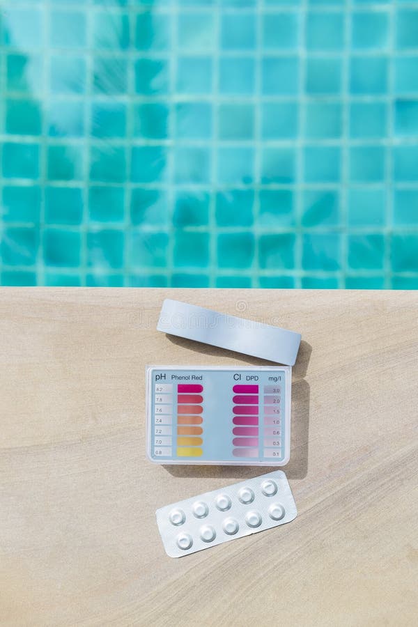 Tablet for Water Testing in Girl Hand Over Pooltester Test Kit on ...