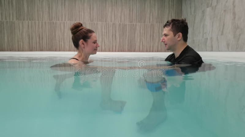 Water Therapy Session Relaxation and Bonding in a Calming Pool ...