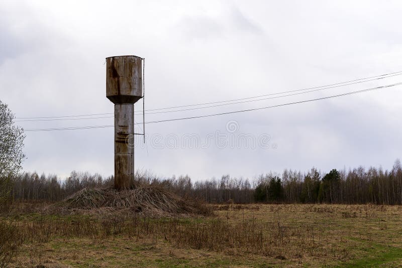 Water tower in the field stock photo. Image of storage - 220573316