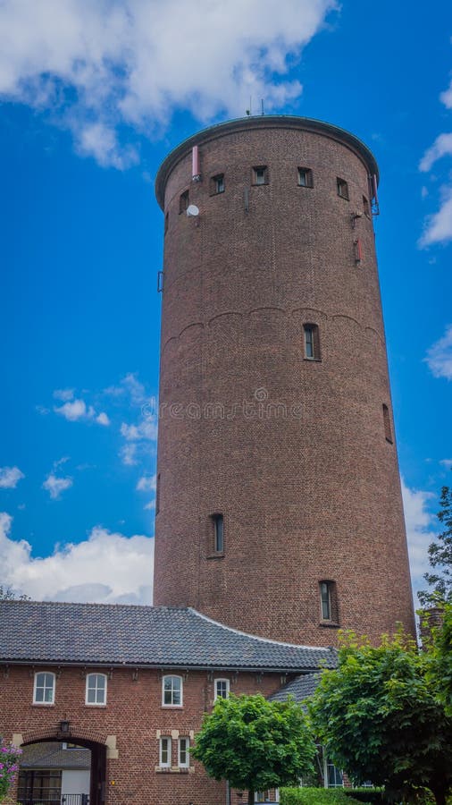 Water Tower Made of Bricks with Side Building and Gate Stock Photo ...