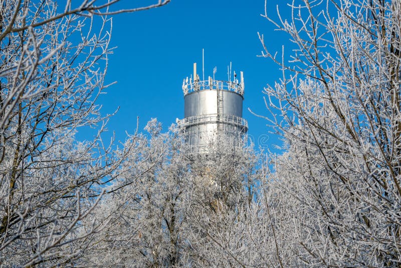 Water Tower Over a Winter Tree Tops Stock Image - Image of industrial ...