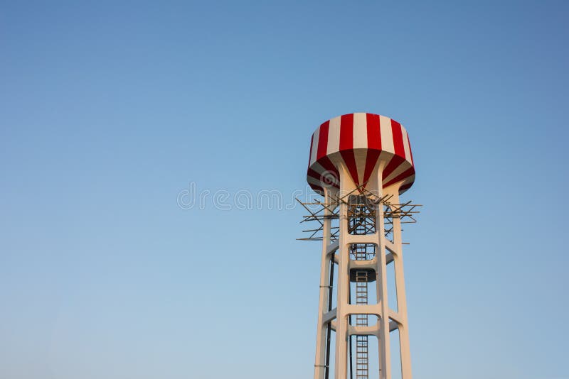 Red and white water tower stock image. Image of store - 14000971