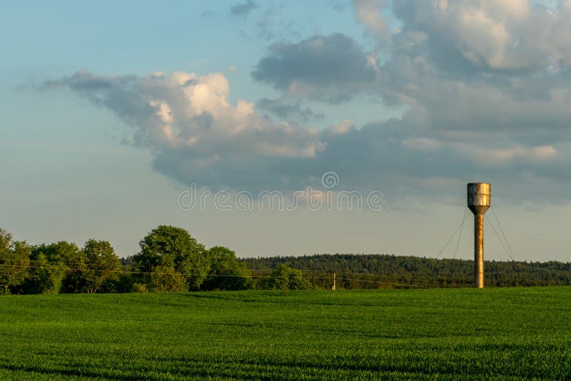 The Water Tower Stands on a Field of Wheat. Automatic Irrigation ...