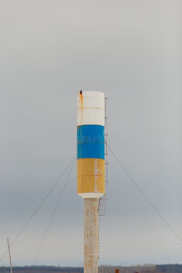 Water Tower with White, Blue and Orange Stripes Stock Photo - Image of ...