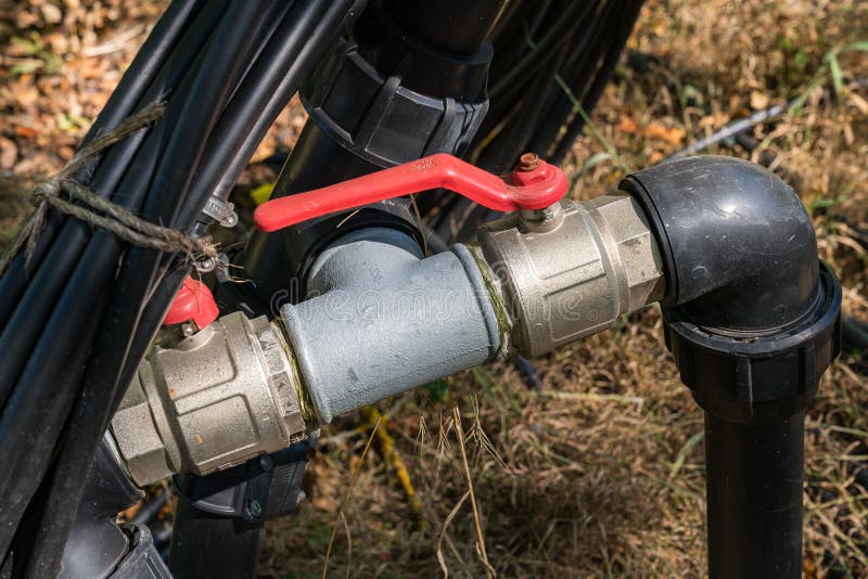 Water Valve Connection on Irrigation System in a Rural Setting Stock ...