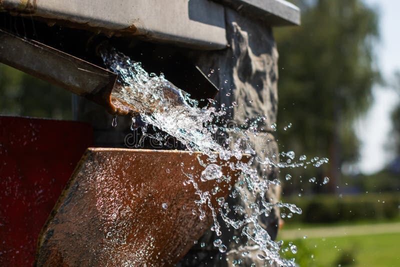Water is Vigorously Splashing Out of a Rusty and Old Pipe Stock Image ...