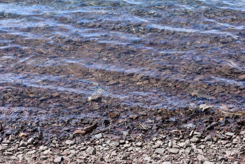 Water Waves Washing Over the Shoreline Stock Photo - Image of serene ...