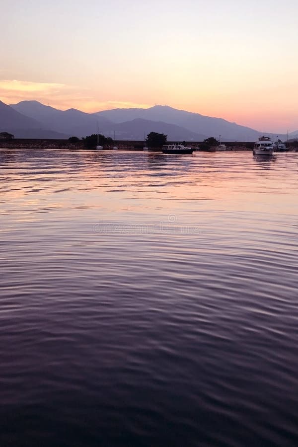 Water Wave in Wharf and Gradient Orange Sky at Sunset Stock Image ...