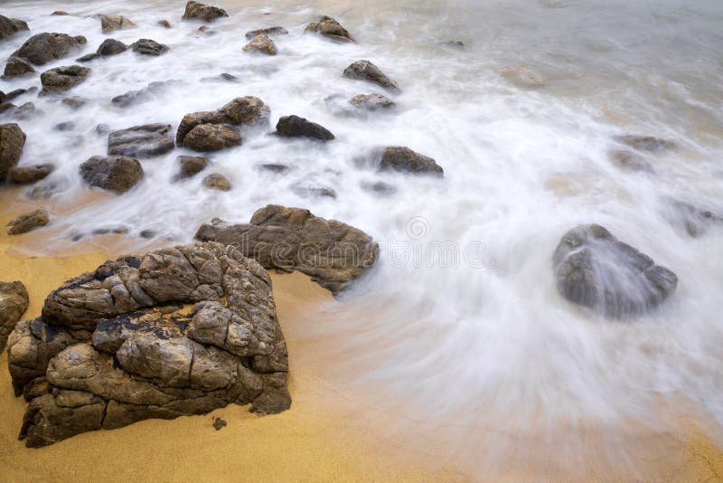 Water waves and the rocks stock image. Image of nature - 111707505