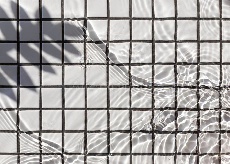 Water Wavy Texture on the White Ceramic Tile Background with Leaf ...