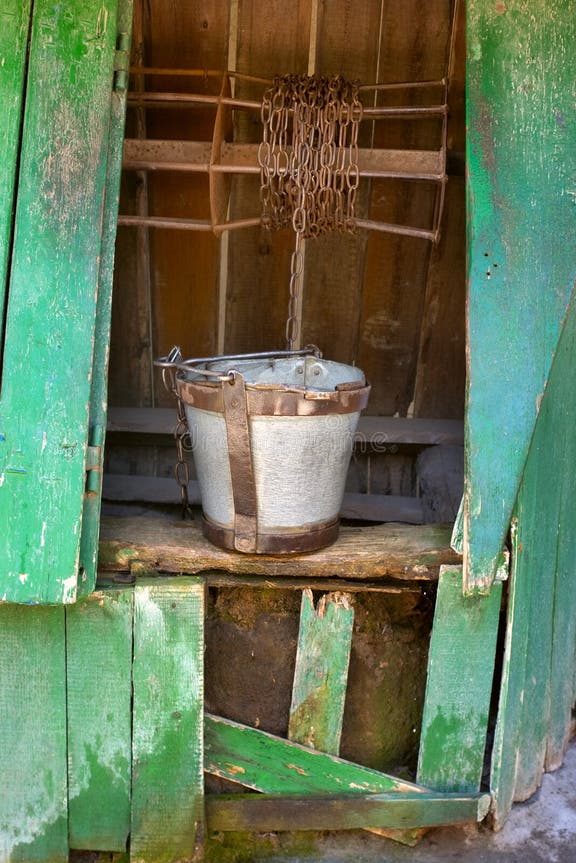 Water well with bucket stock photo. Image of bucket, plank - 10738886
