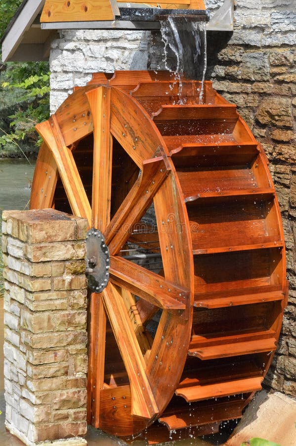A Water Wheel on a Building Stock Image - Image of blue, blur: 77770783