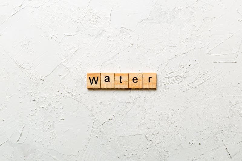 Water Word Written on Wood Block. Water Text on Cement Table for Your ...