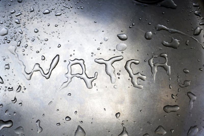 Water written with water stock photo. Image of liquid - 21635074
