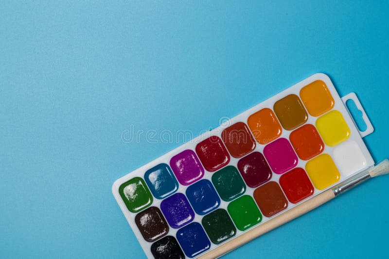 Watercolor Paint Set in the Plastic Box on Blue Background Stock Image ...