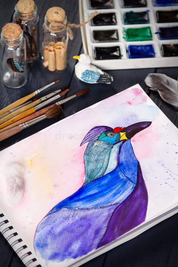 Watercolor Painting of Blue Bird and Artistic Tools on Table Stock ...
