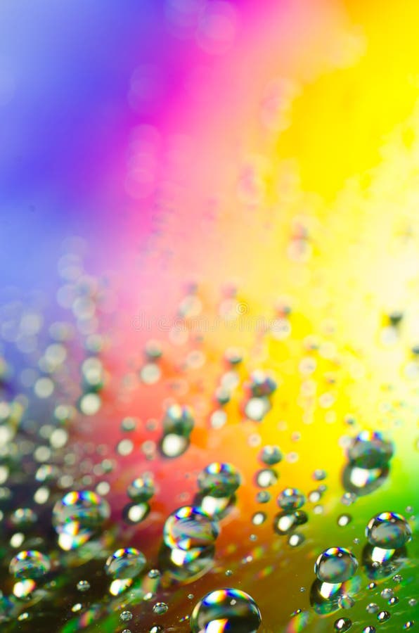 Waterdrops on Rainbow Coloured Parasol Stock Photo - Image of hues ...