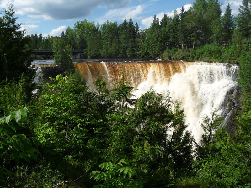 A Waterfall is Overflowing with Water Flowing from it Stock Photo ...