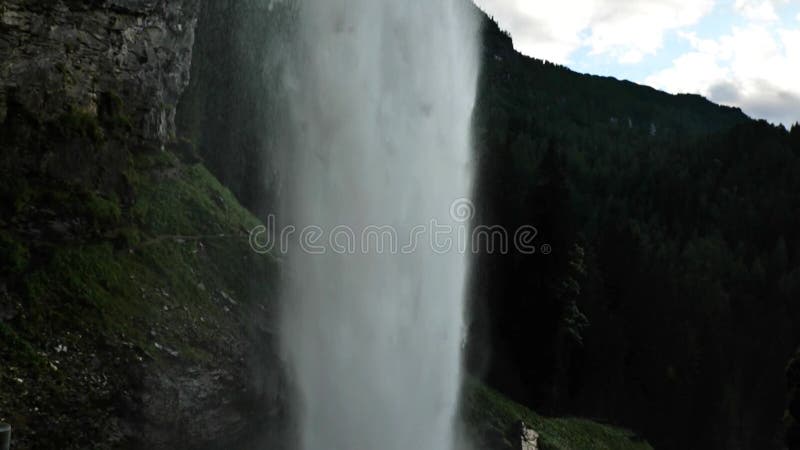 Waterfall in the Alpine Mountains.Slow Fall of Water Flow Down. Stormy ...