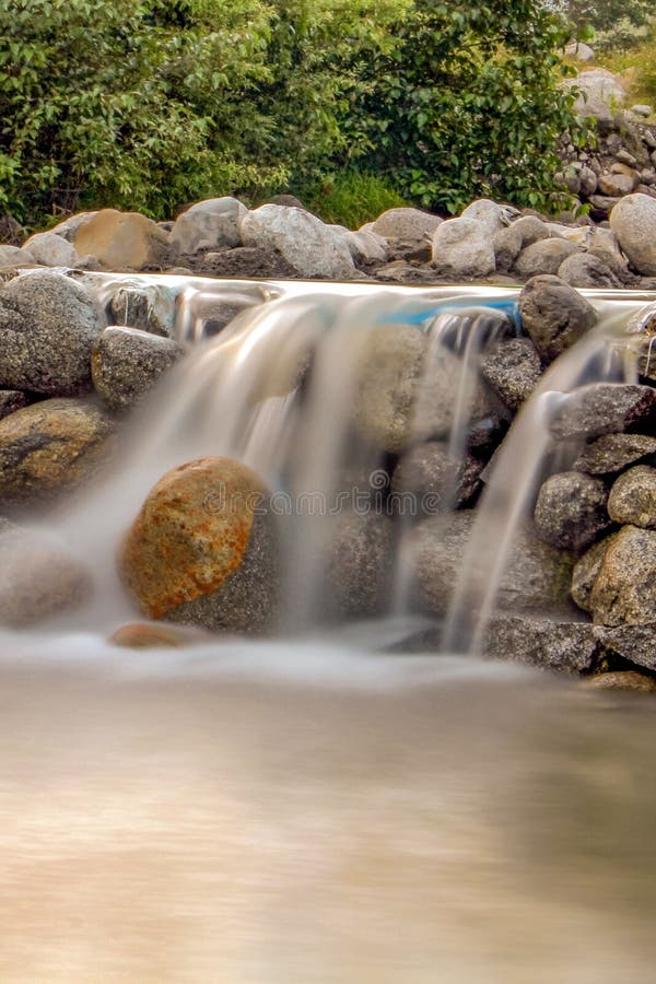 A Waterfall is an Area Where Water Flows Over a Vertical Drop or a ...