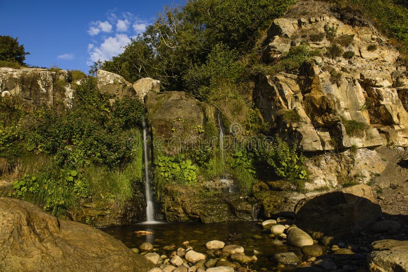 Waterfall on the beach stock image. Image of river, forest - 262514237