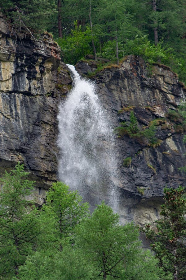 A Waterfall Breaks through the Mountain in the Forest Stock Photo ...