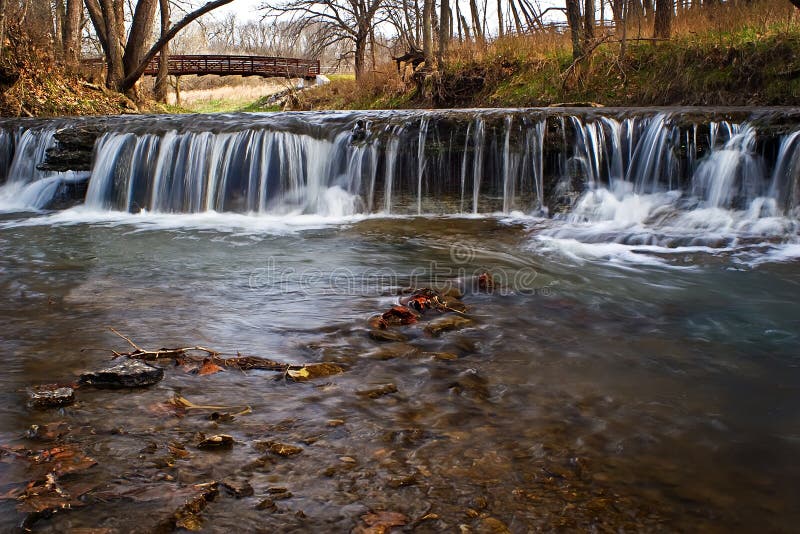 Waterfall with Bridge stock photo. Image of creek, river - 13740270