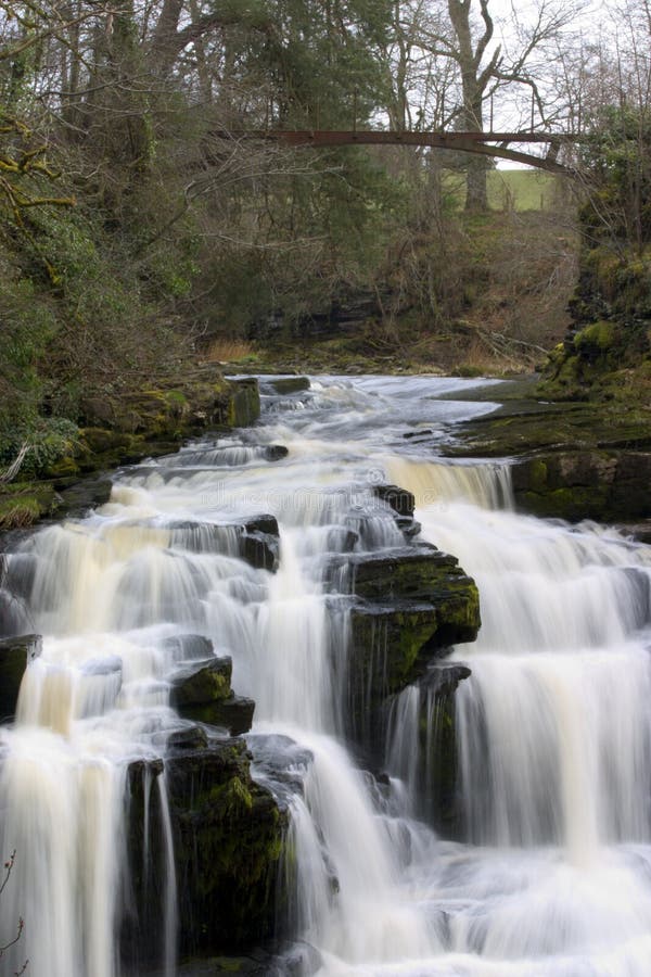 Waterfall and bridge stock photo. Image of iron, brook - 681686