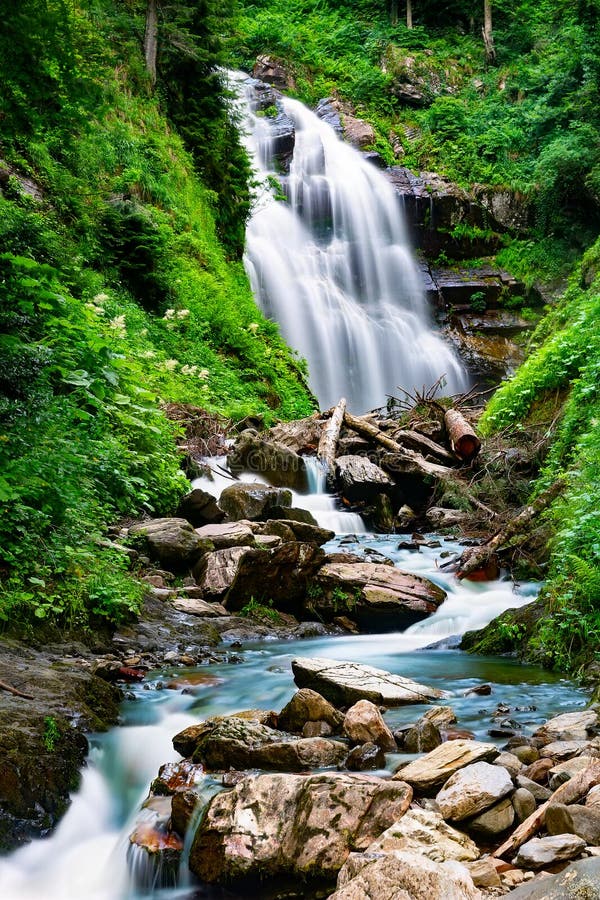 Waterfall Cascade on Mountain Rocks. a Mountain Waterfall Flows Over ...
